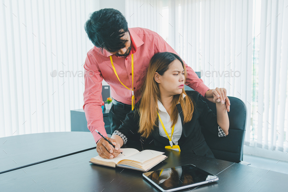 Boss or supervisor touching female employee's shoulder Causing young ...