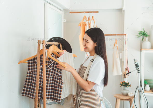 Small business owners are organizing and arranging a small store to ...