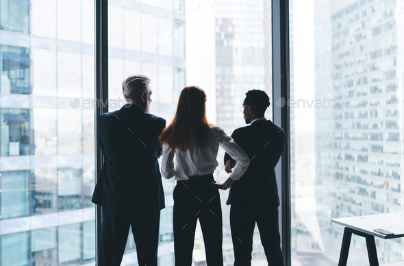 Faceless multiethnic businesspeople discussing project in office Stock ...
