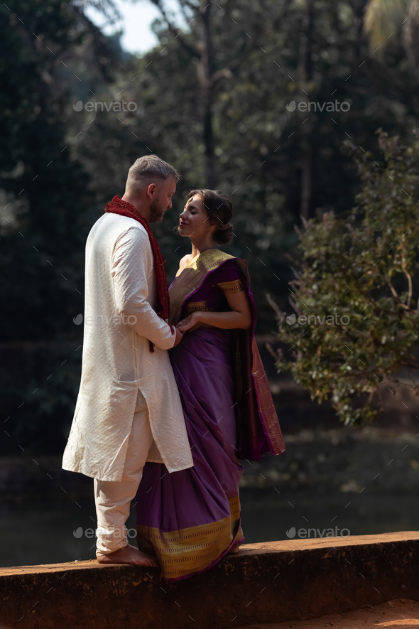 Wedding of a couple from Europe in India. A light skinned man in a ...