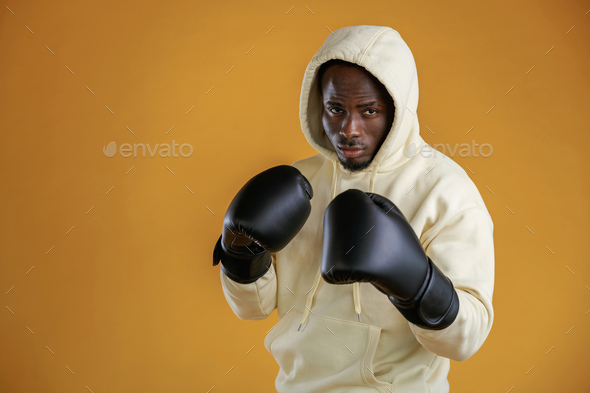 In hood. Boxer is ready to fight. Black guy is against yellow ...