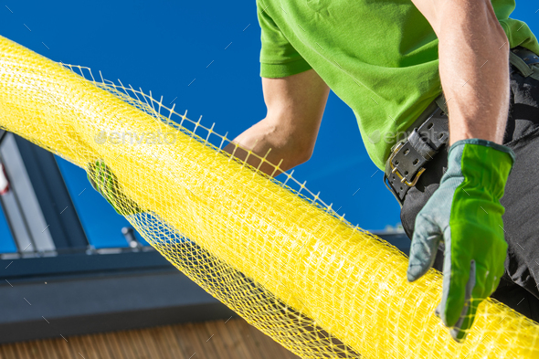 Garden Worker Installing Mole Repellent Netting Stock Photo by duallogic