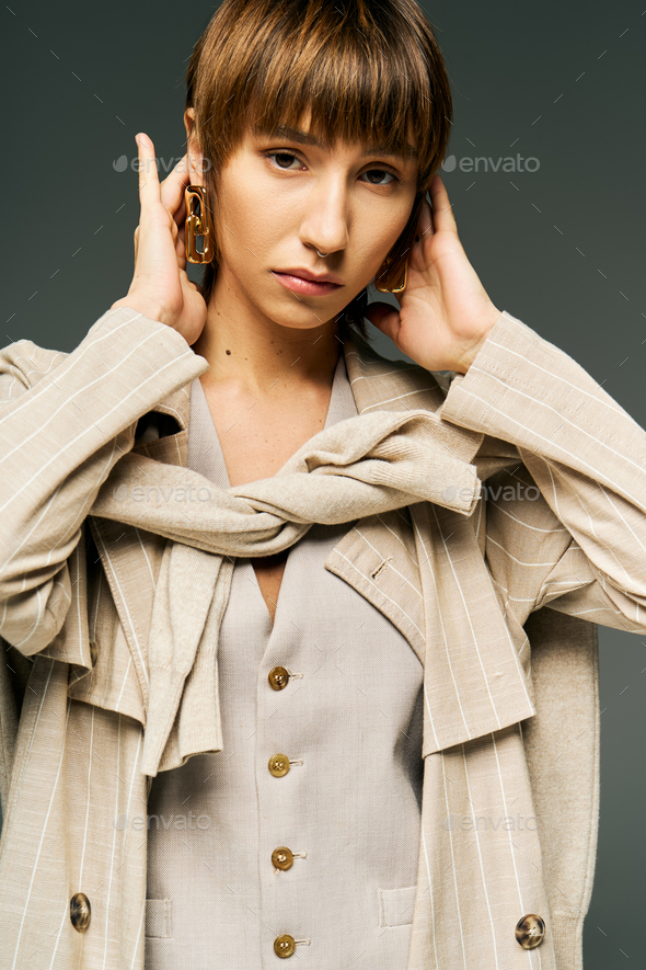 Elegance unveiled: woman adorned in scarf Stock Photo by LightFieldStudios