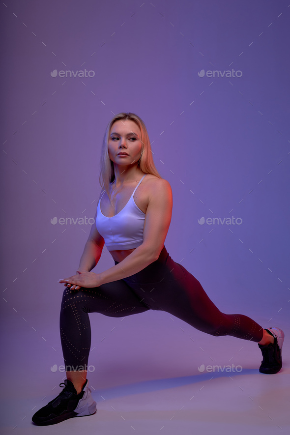 skilled sportswoman doing lunges exercises for leg muscle Stock Photo ...