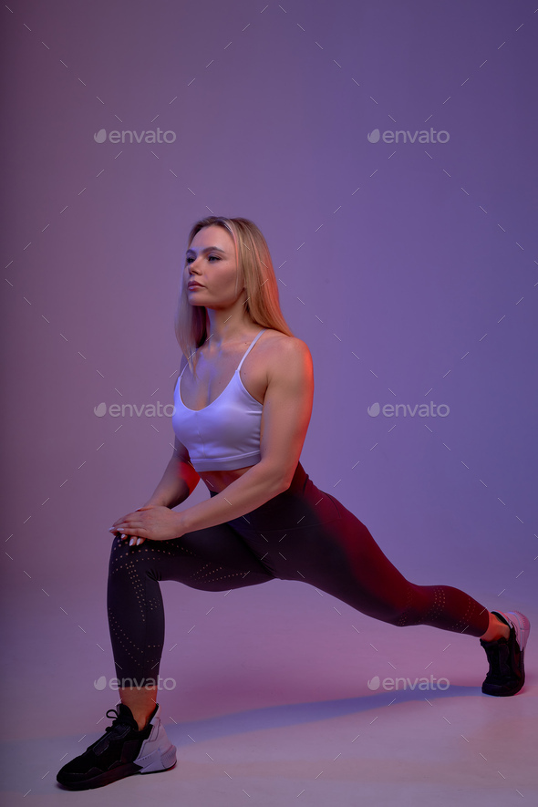 motivated girl doing front forward one leg step lunge exercise Stock ...