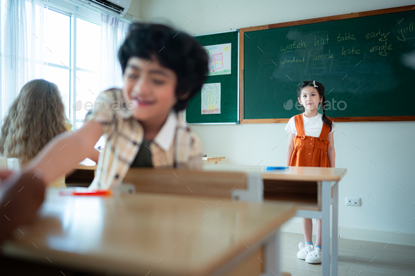 Children with classroom presentation activities in front of the ...