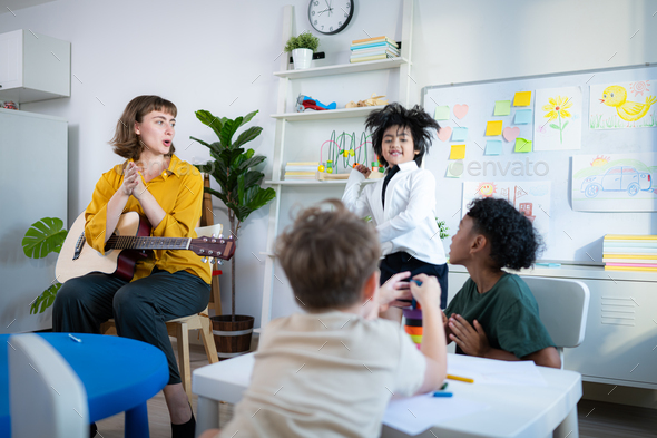 In class, The teacher and students sing together, and the boys dance ...