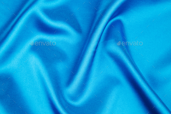 Folds of deep blue silk texture. Stock Photo by indigolotos | PhotoDune
