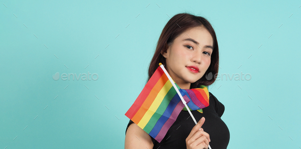 LGBTQ girl and pride flag. Sexy Lesbian girl and LGBT flag standing ...
