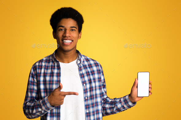 Present new app. Guy pointing at blank screen phone Stock Photo by ...
