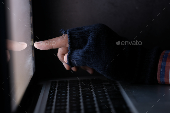 hacker hand pointing finger on laptop screen Stock Photo by towfiqu98