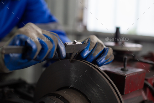 Engineering worker man wearing uniform safety working using vernier ...