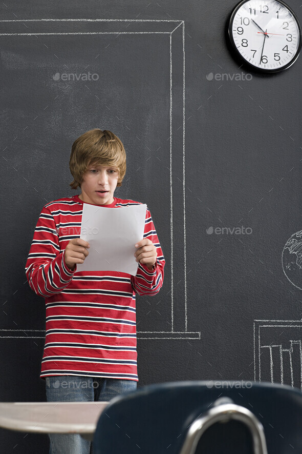 Teenager giving a presentation in a classroom Stock Photo by Image-Source
