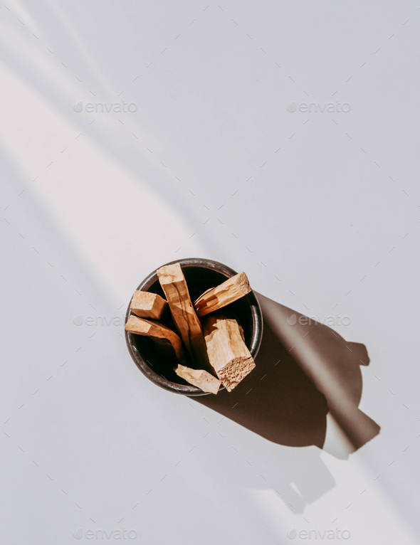 Wooden sticks Palo Santo in black box on light background Stock Photo ...