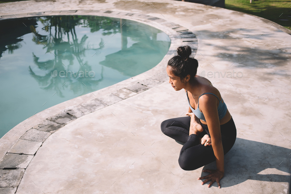 Flexible woman balancing in Scale pose Stock Photo by GaudiLab | PhotoDune