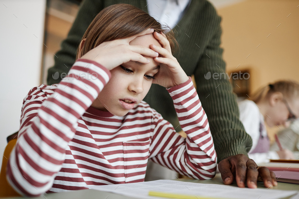 Boy Struggling To Do Task In Class Stock Photo by AnnaStills | PhotoDune