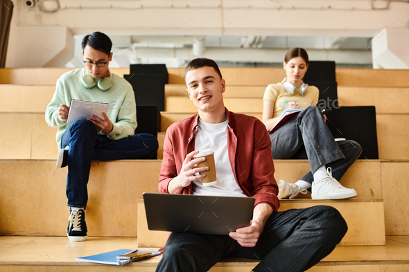Multicultural student embracing technology on staircase Stock Photo by ...