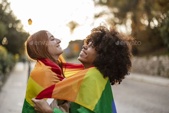 Joyful Friends multiracial with Rainbow Flag Stock Photo by ...