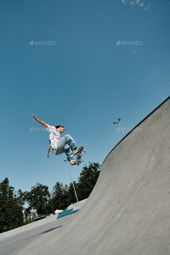 Defying gravity: skater soars up ramp Stock Photo by LightFieldStudios