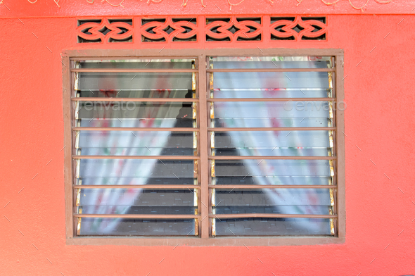 The weathered frame of the old traditional Malay house's window exudes ...