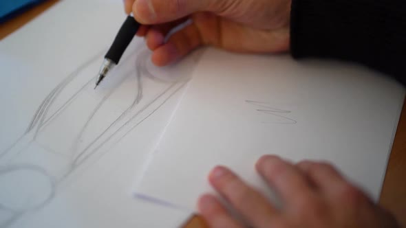 Close up of person drawing a car sketch on paper., Stock Footage ...