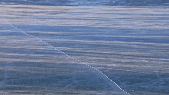 Snow Is Flying Over Surface of Ice. Snowflakes Fly on Ice of Lake ...