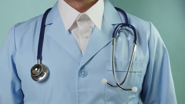 Doctor in Professional Medical Suit with Stethoscope and Blue Gloves ...