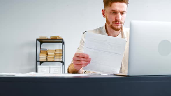 Professional accountant checks comparing paper reports, Stock Footage