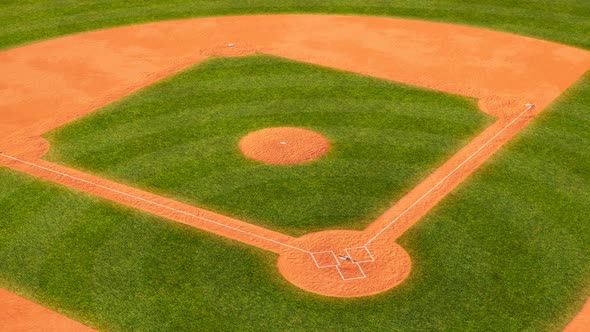 Huge green baseball field. Sport stadium with grass and orange field ...