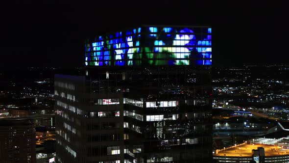 Aerial, Target Plaza South in Minneapolis at night. Parallax effect ...