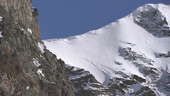Snow Eaves and Rocky Cliff at Mountain Summit, Stock Footage | VideoHive