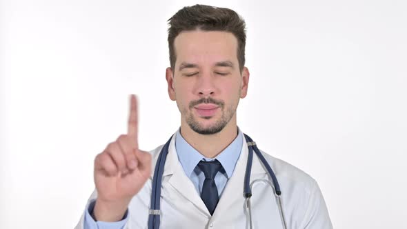 Portrait of Young Male Doctor Saying No with Finger Sign, White ...