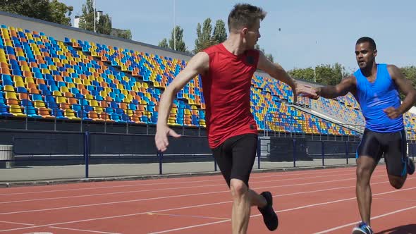 Athletes Training Relay Race on Empty Stadium, Teamwork, Aspiration to ...