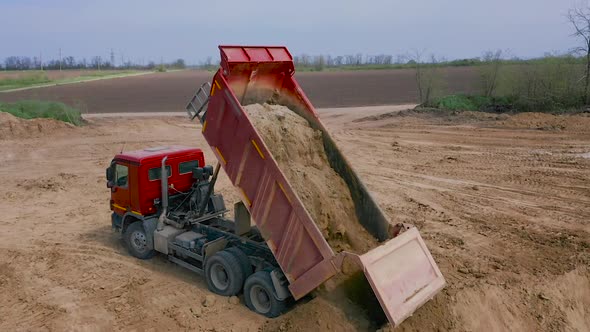 Dump Truck Unloads Sand in Construction, Stock Footage | VideoHive
