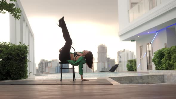 Sensuous Dancer Leaning Back On Chair And Kicking Legs In High Heels ...