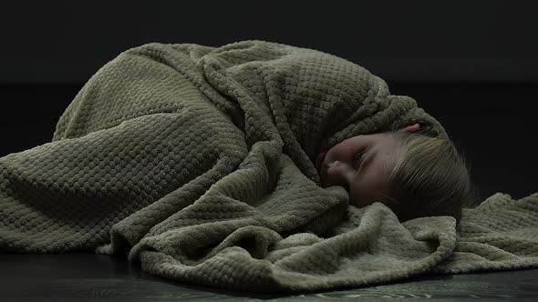 Scared Girl Flinching From Fear, Lying on Floor and Covering Head With ...
