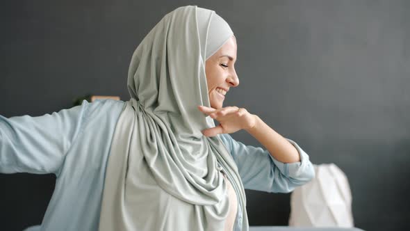 Tiltdown Slow Motion Portrait of Happy Young Muslimah Dancing Having ...