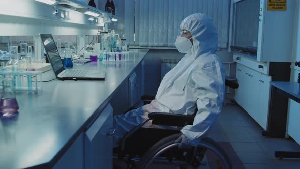 Disabled Scientist in Wheelchair Working in Lab, Stock Footage | VideoHive