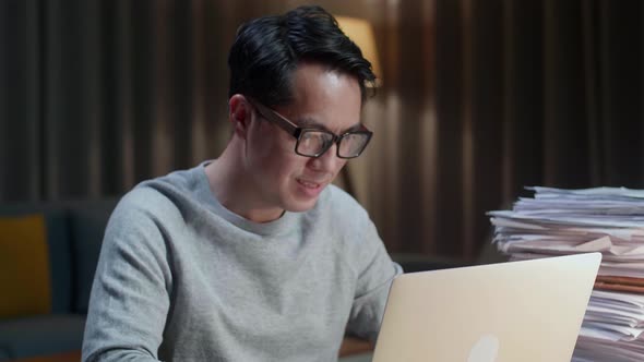 Close Up Of Asian Man Typing Laptop Computer While Working With ...