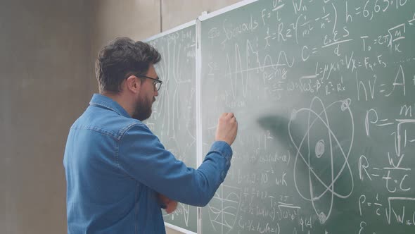 Teacher Man Writing Math Formulas on Chalkboard with White Chalk, Stock ...