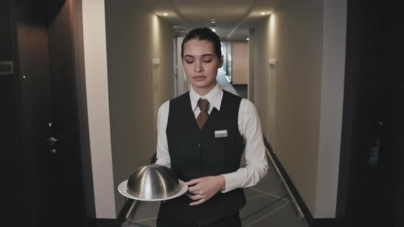Waitress Walking along Hotel Corridor with Serving Tray, Stock Footage