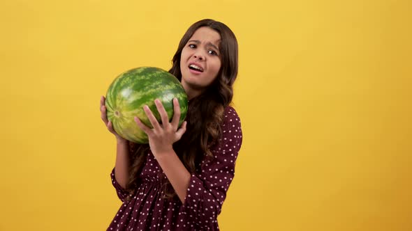 Confused Teen Girl Taking Heavy Water Melon Watermelon, Stock Footage