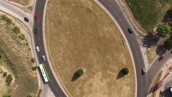 Ellipse shape roundabout in Spain with vehicles and public busses, aerial top down view, Stock ...