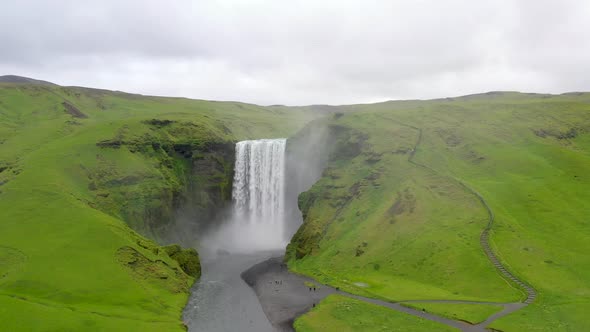 Skogafoss waterfalls in Iceland with drone video moving in., Stock Footage