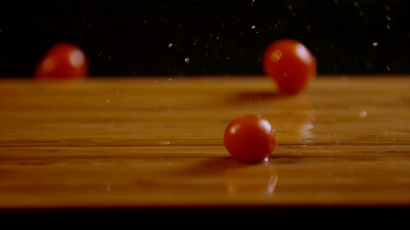 Cherry tomatoes bouncing and rolling, Ultra Slow Motion, Stock Footage