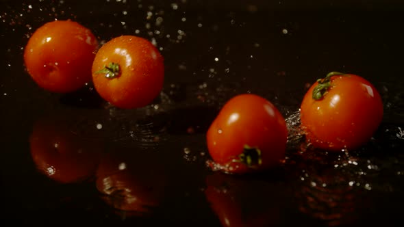 Tomatoes falling and spinning on wet surface, Ultra Slow Motion, Stock ...