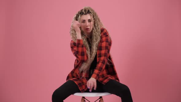 Girl Dancing While Sitting on a Chair, Stock Footage | VideoHive