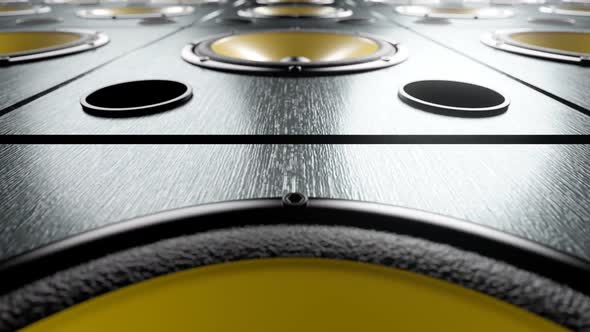 Moving Over Audio Speakers with Yellow Membranes Playing Rhythmic Music ...