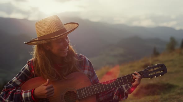 Happy Guitarist Smiling Outdoors in Mountains Closeup, Stock Footage