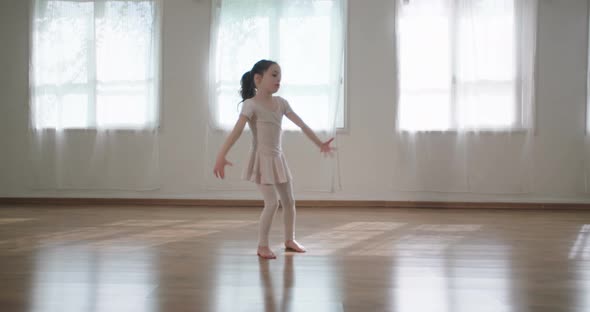 Little girl dancing alone in a studio, Stock Footage | VideoHive
